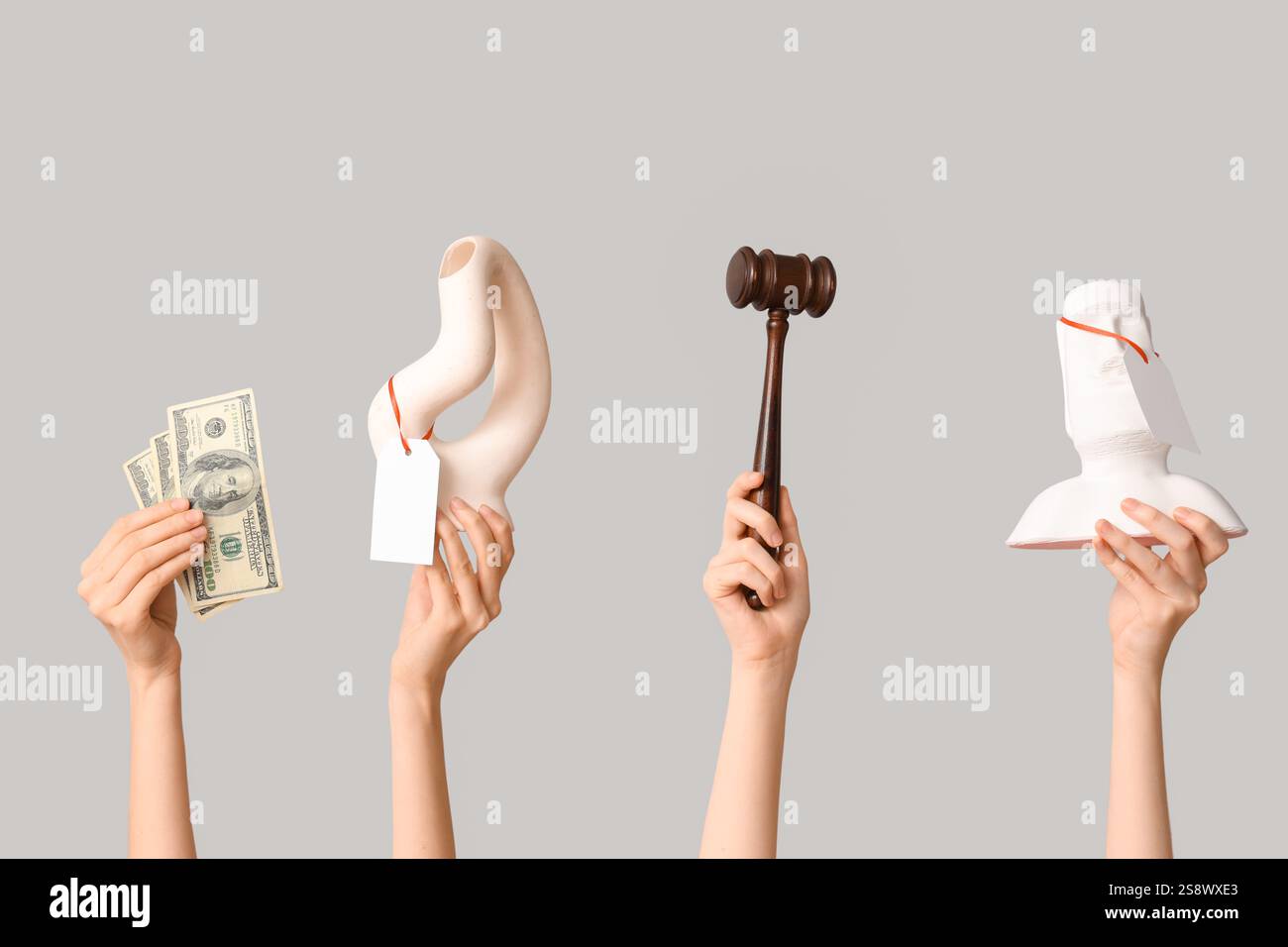 Female hands with auction gavel, dollar banknotes and antique items on ...