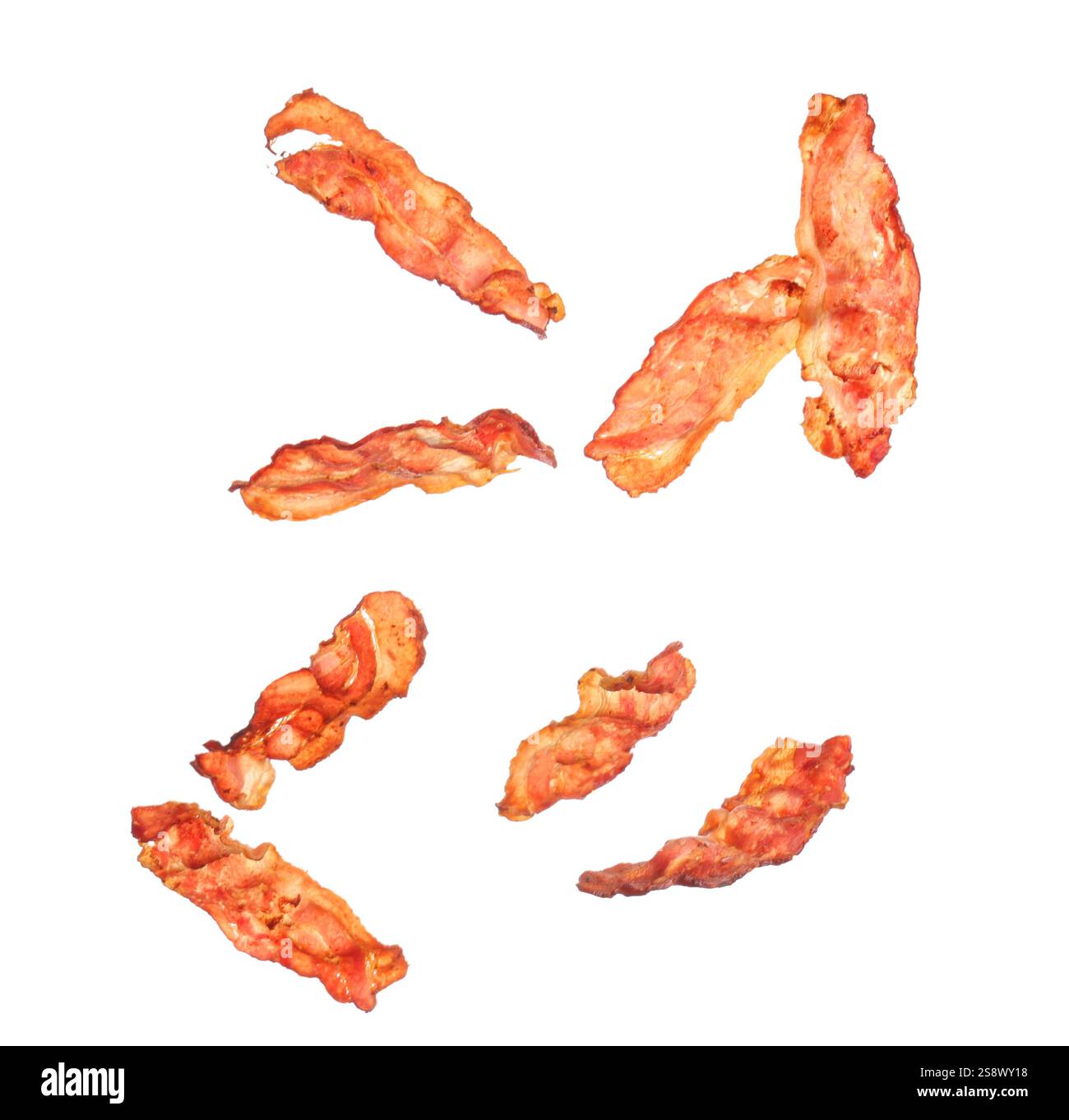 Flying fried bacon rashers on white background Stock Photo - Alamy