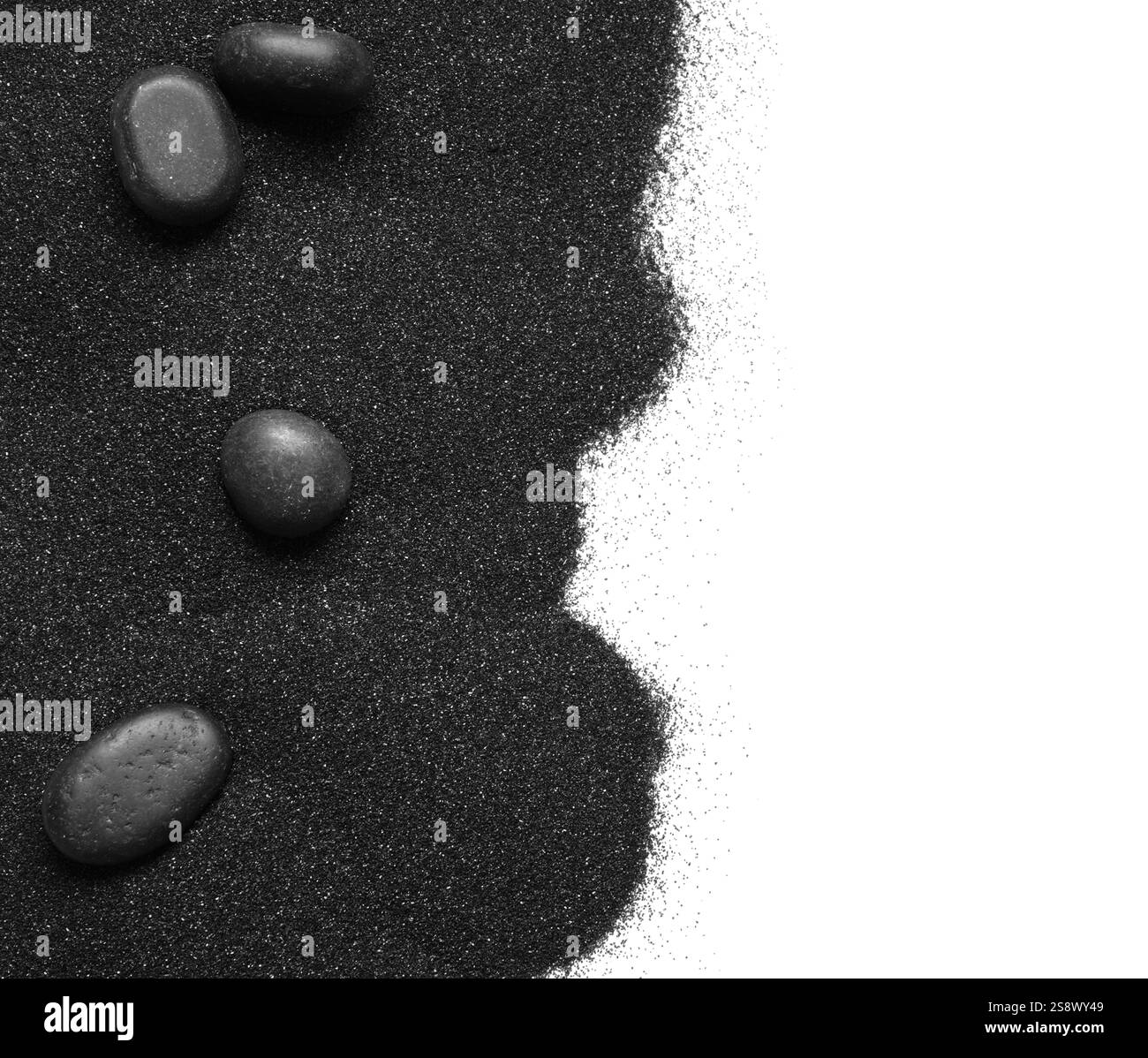 Black beach sand with pebbles on white background Stock Photo - Alamy