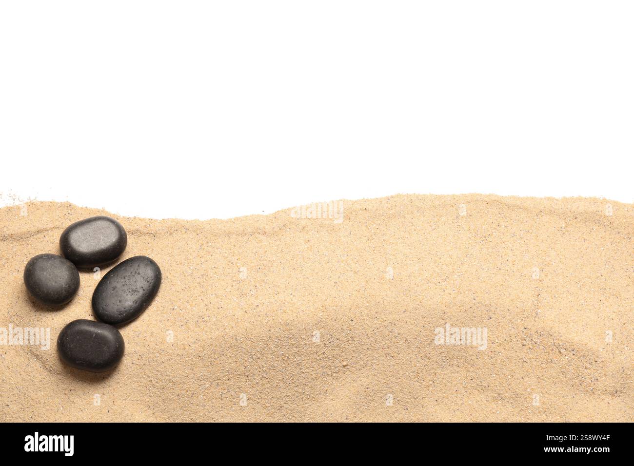 Light beach sand with black pebbles on white background Stock Photo - Alamy