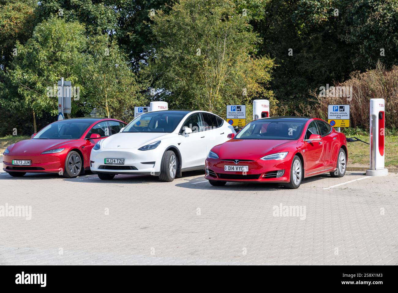 Three tesla models charging hi-res stock photography and images - Alamy