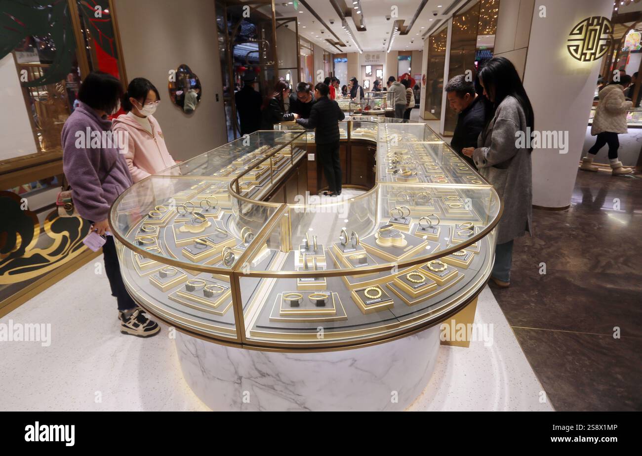 SHANGHAI, CHINA - JANUARY 23, 2025 - Customers spend money at a gold store in Shanghai, China ...