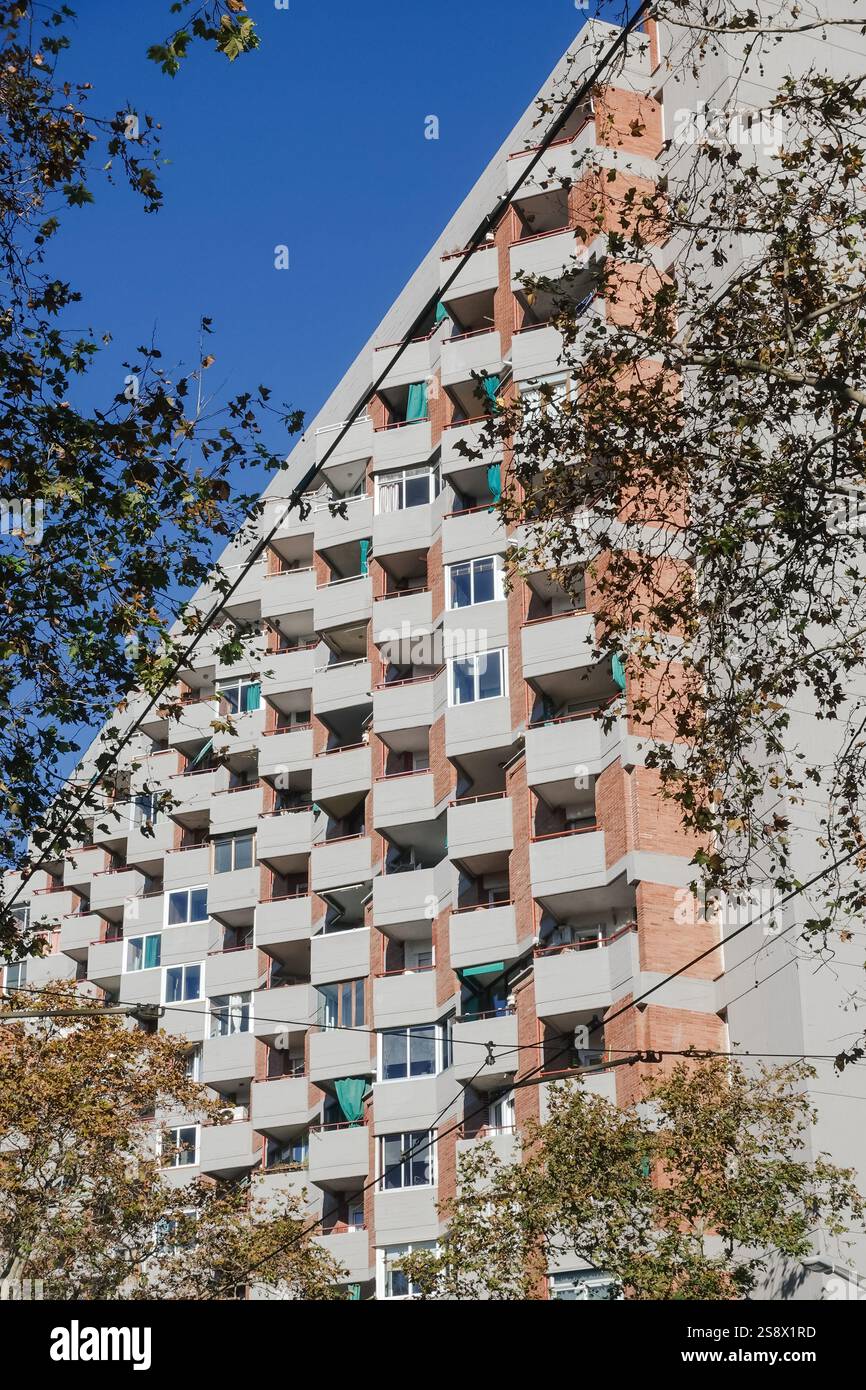 The facade of an apartment building in Barcelona features balcony ...
