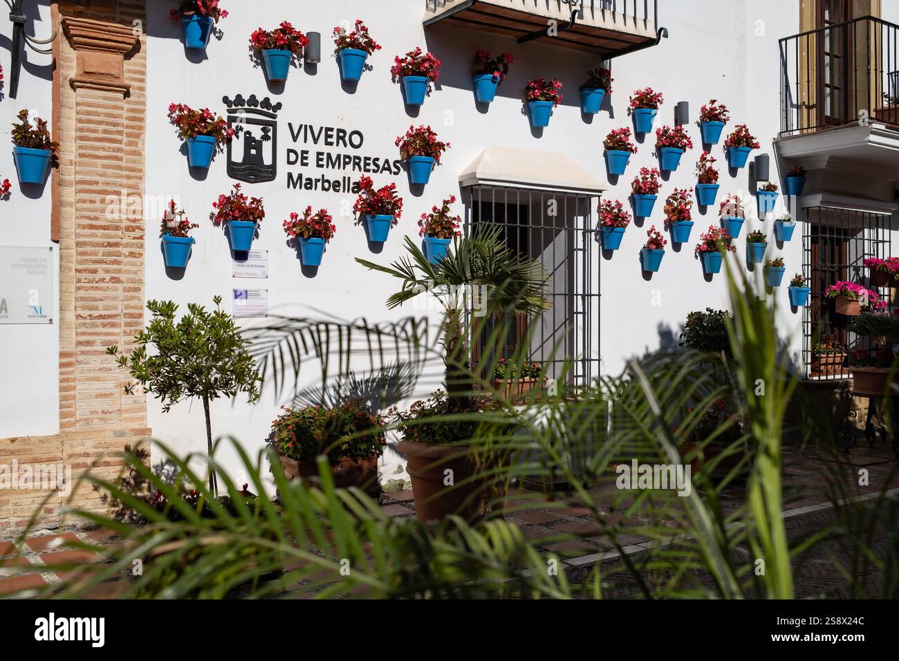 Town hall and plant pots in Marbella, Spain: Plaza de los Najangos ...