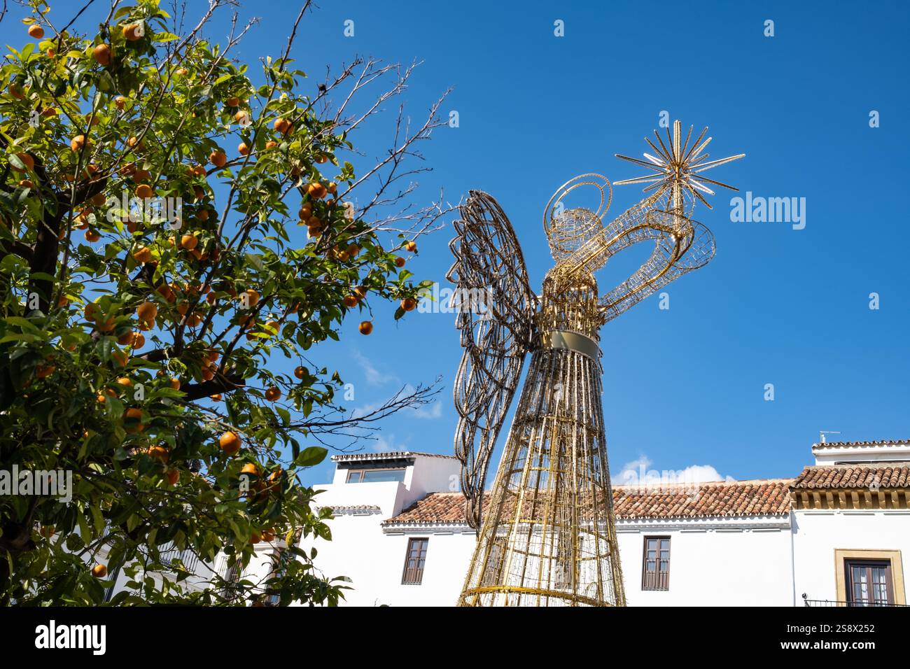 Golden Angel in Marbella, Spain: Plaza de los Najangos (orange tree ...