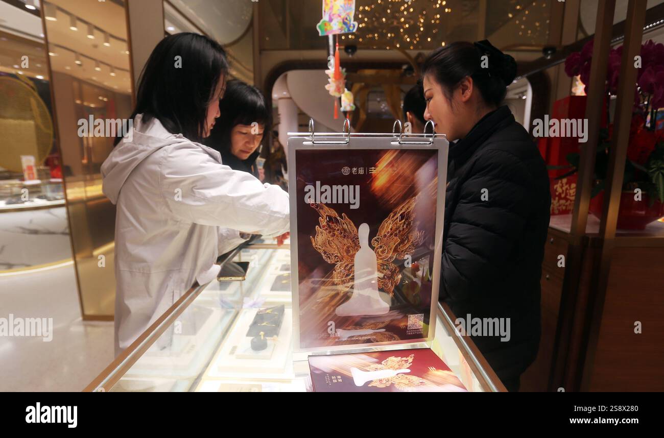 SHANGHAI, CHINA - JANUARY 23, 2025 - Customers spend money at a gold store in Shanghai, China ...