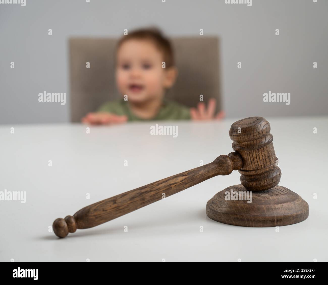 Little boy behind judge's gavel Stock Photo - Alamy