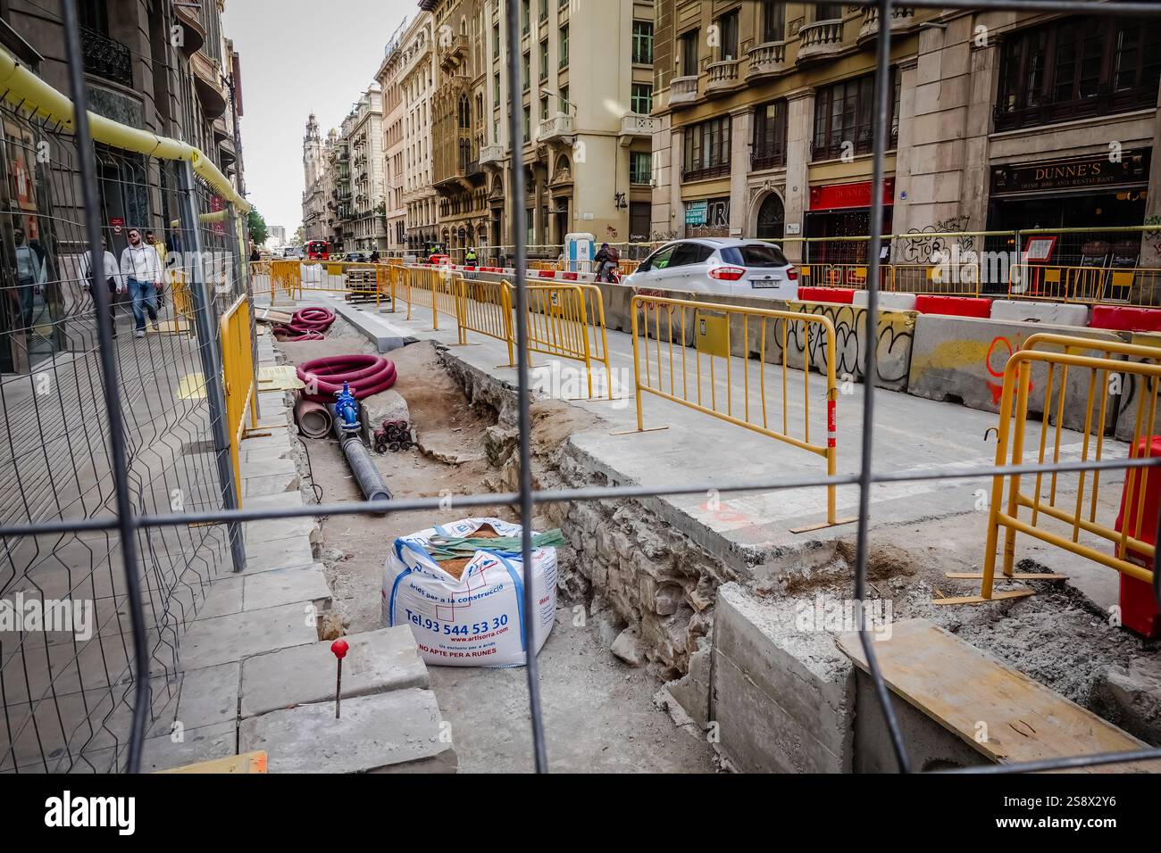 Roads in Barcelona are fenced off due to construction work, with ...