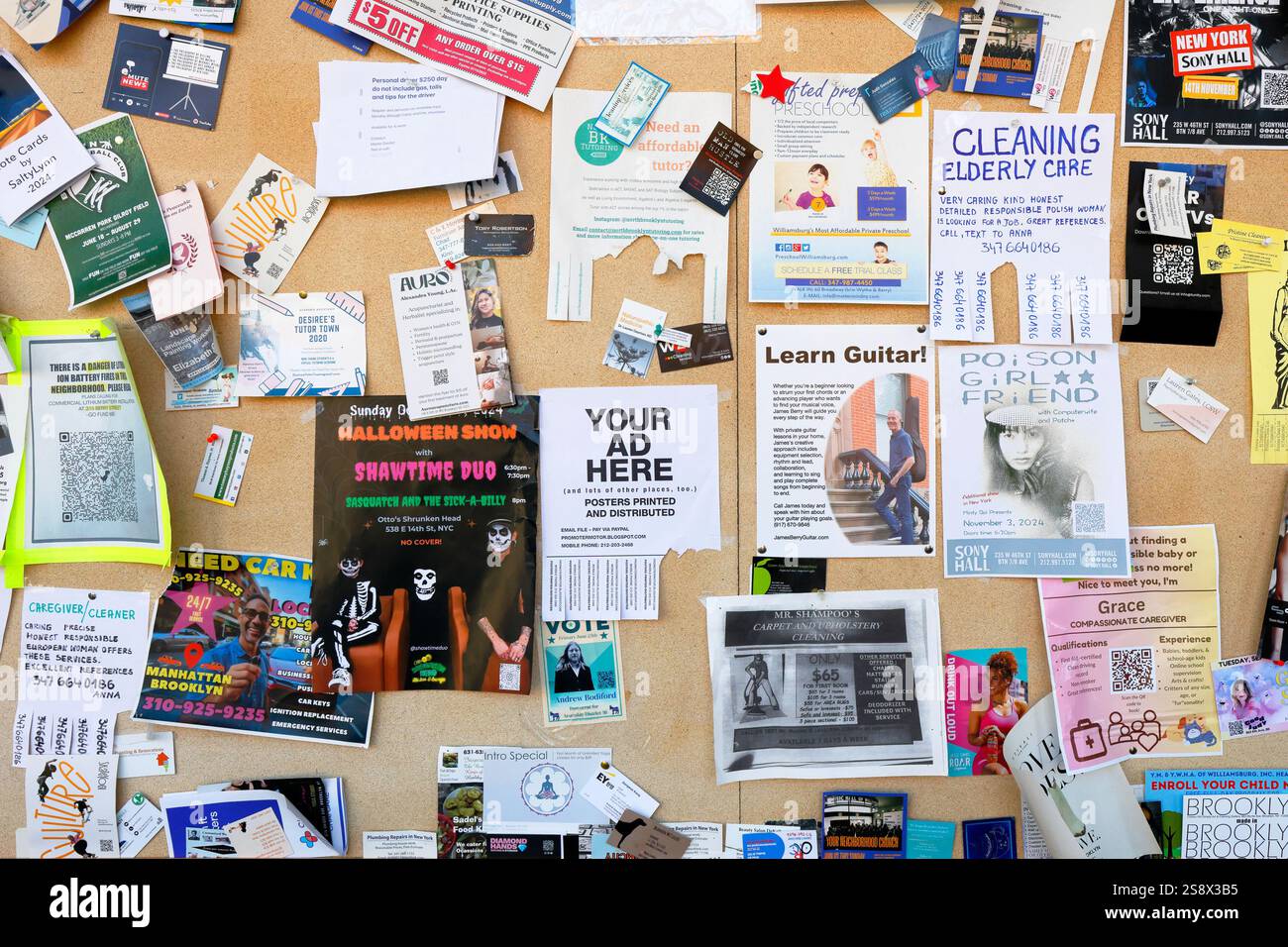 Flyers, posters, and advertising on a community bullentin board Stock ...