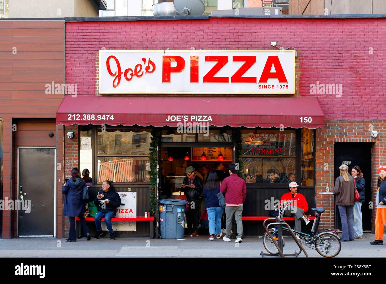 Joe's Pizza, 150 E 14th St, New York, NYC storefront of a pizzeria in Manhattan's East Village ...