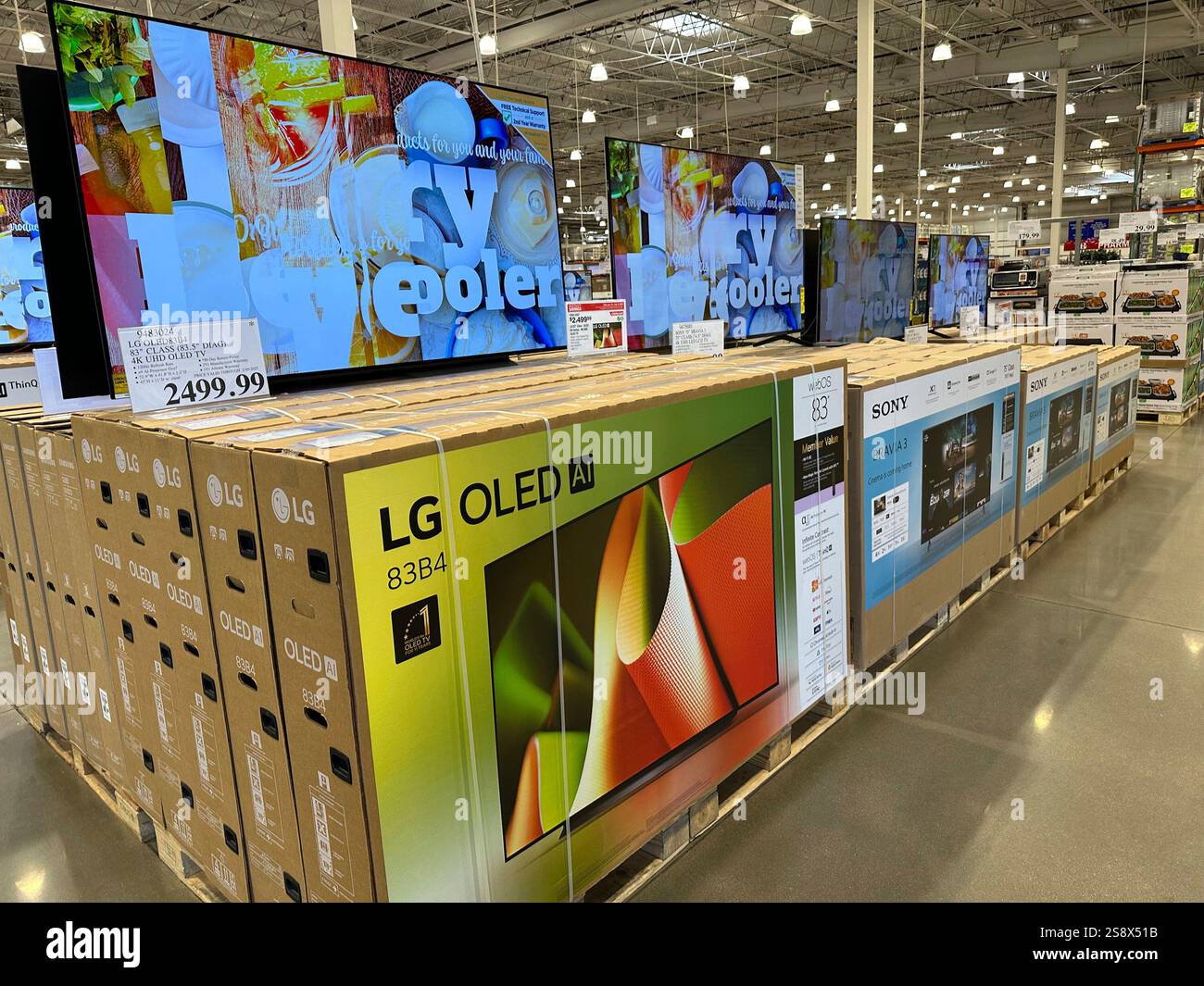 Big-screen televisions sit on display in a Costco warehouse Thursday ...