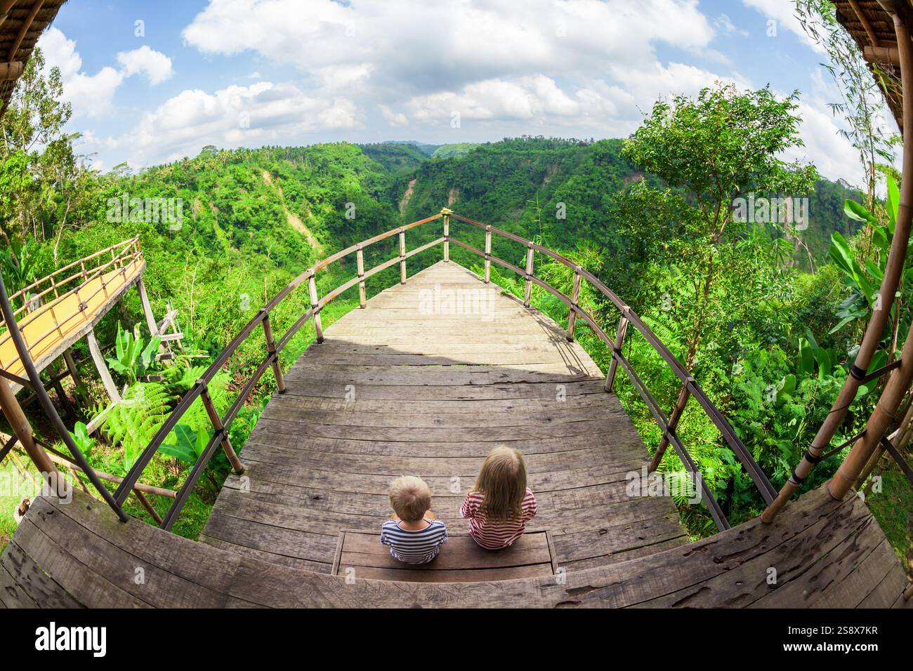 Family vacation lifestyle. Mother and son sitting on balcony on high ...