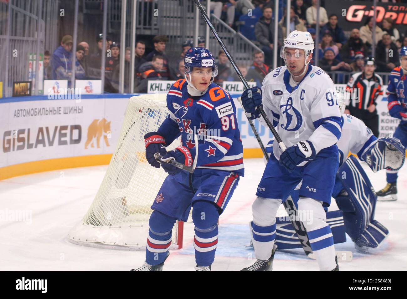 Ivan Demidov (91) of SKA and Igor Ozhiganov (92) of Dynamo Hockey Club ...