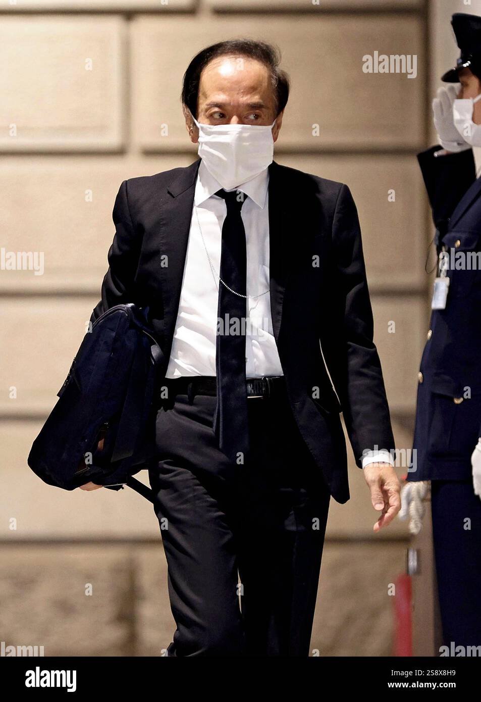 Bank of Japan Governor Kazuo Ueda enters the Bank of Japan headquarters ...