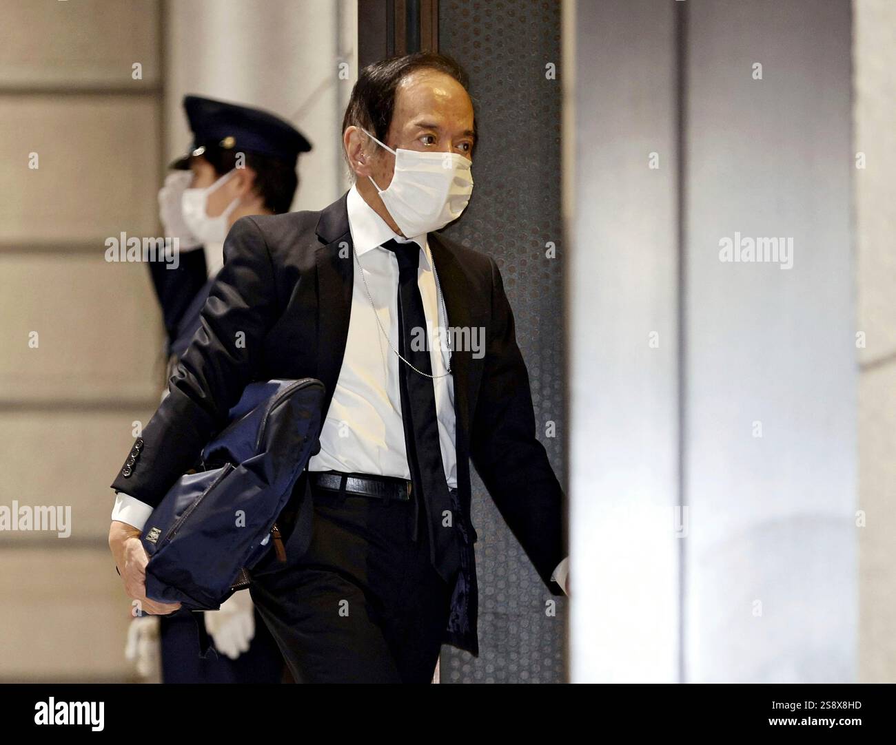 Bank of Japan Governor Kazuo Ueda enters the Bank of Japan headquarters ...