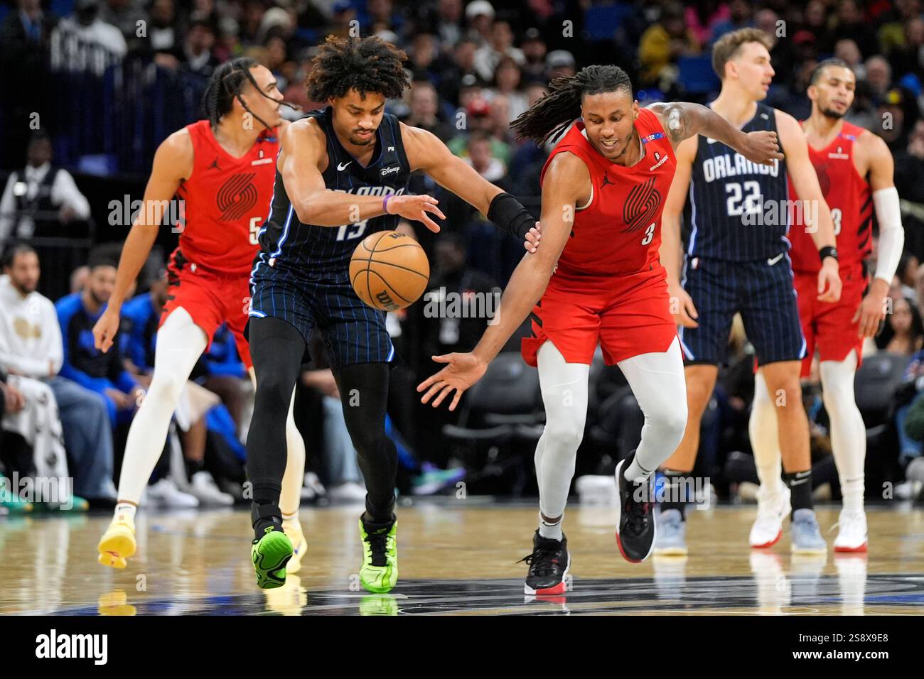 Orlando Magic guard Jett Howard, front left, and Portland Trail Blazers ...