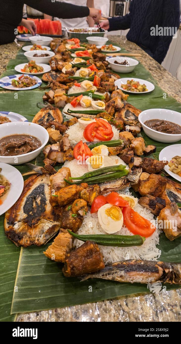 Food on the table for a Filipino Boodle Fight party Stock Photo - Alamy