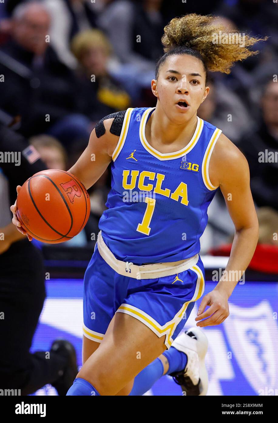 UCLA guard Kiki Rice dribbles against Rutgers during the first half of ...
