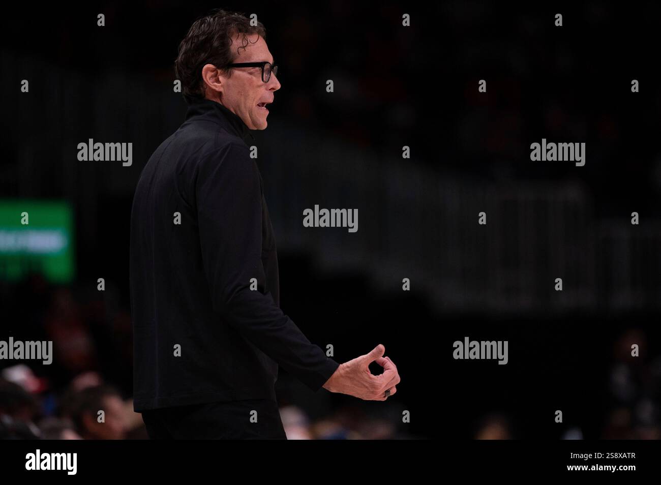 Atlanta Hawks coach Quin Snyder yells to his team during the first half ...