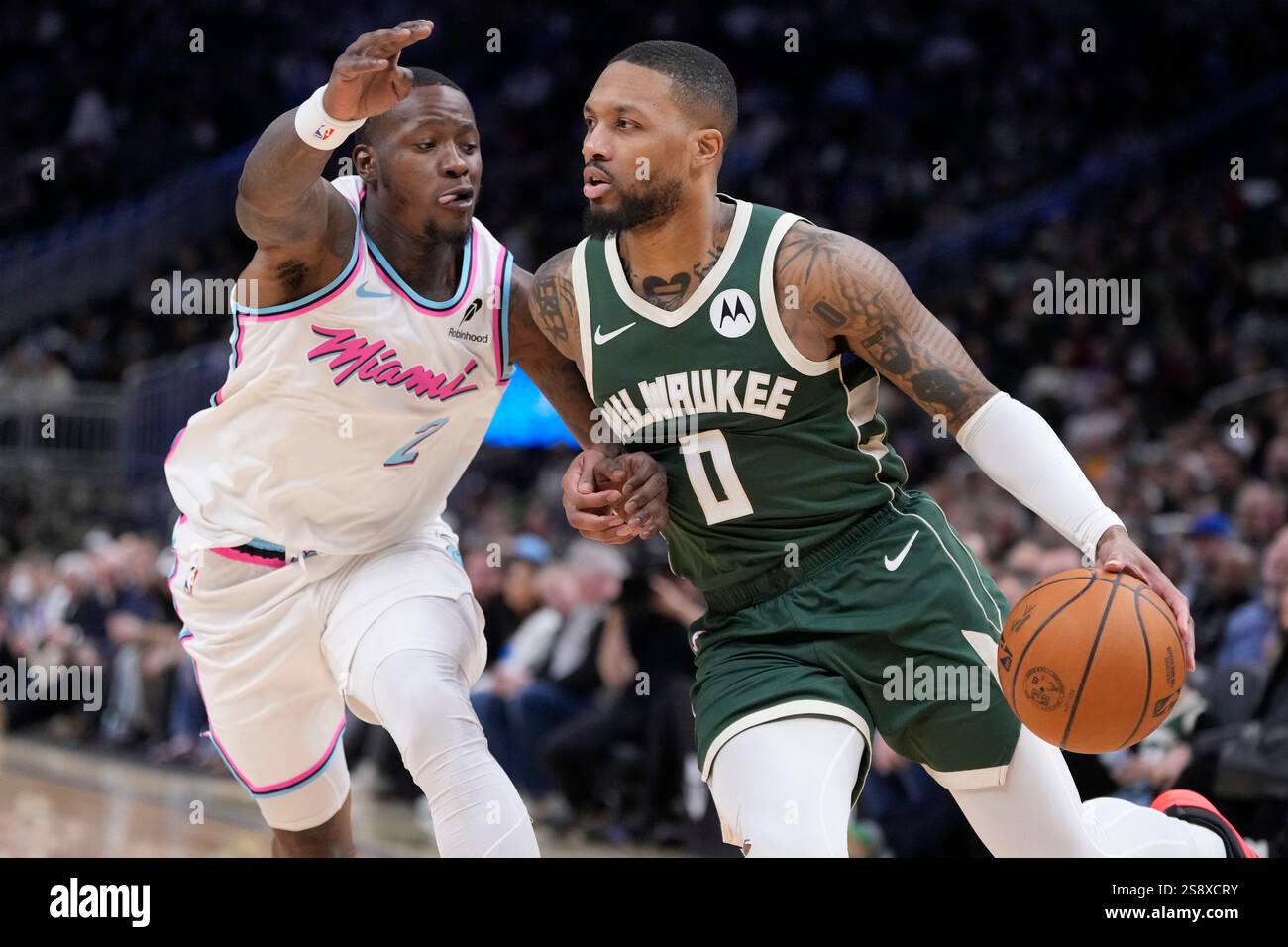 Milwaukee Bucks' Damian Lillard gets past Milwaukee Bucks' Damian ...