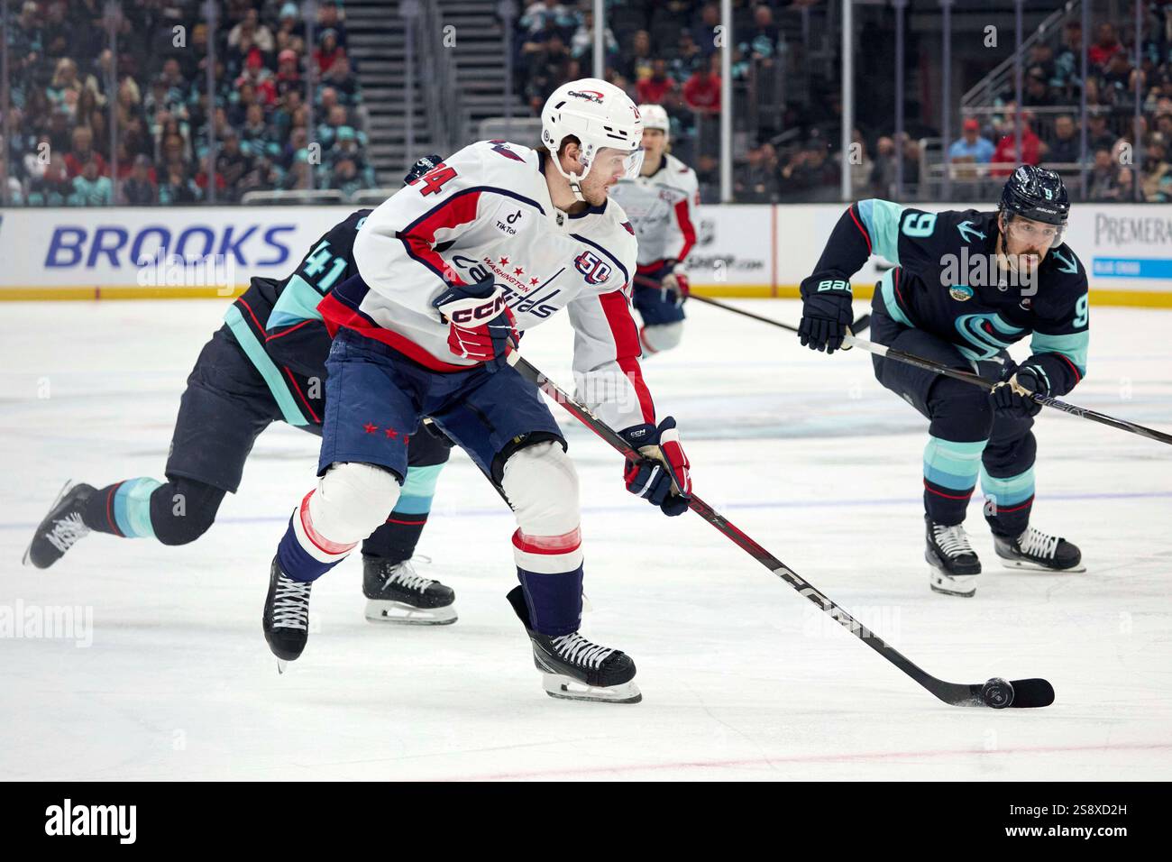 Washington Capitals center Connor McMichael (24) skates with the puck ...