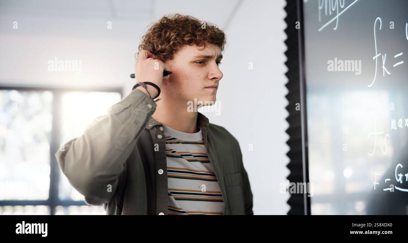 Thinking, confused and math with man in classroom for formula solution ...