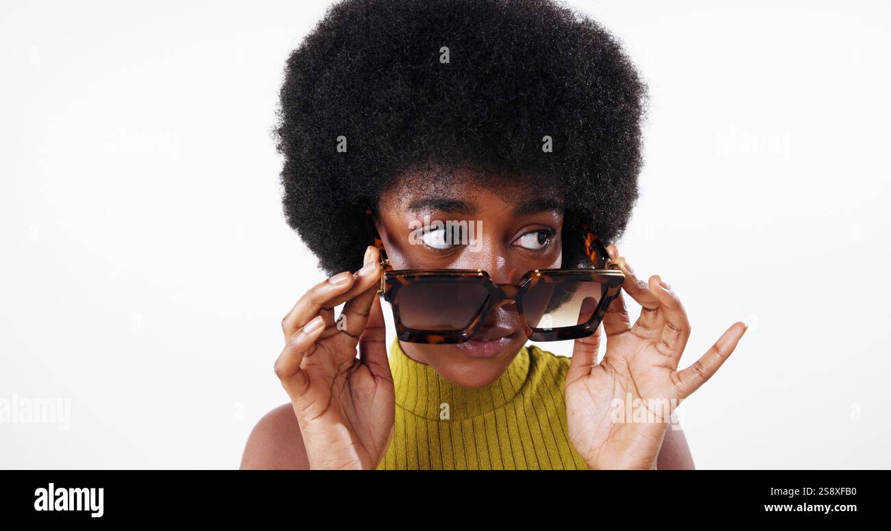 Peeking, sunglasses and black woman in studio, question and attitude on ...