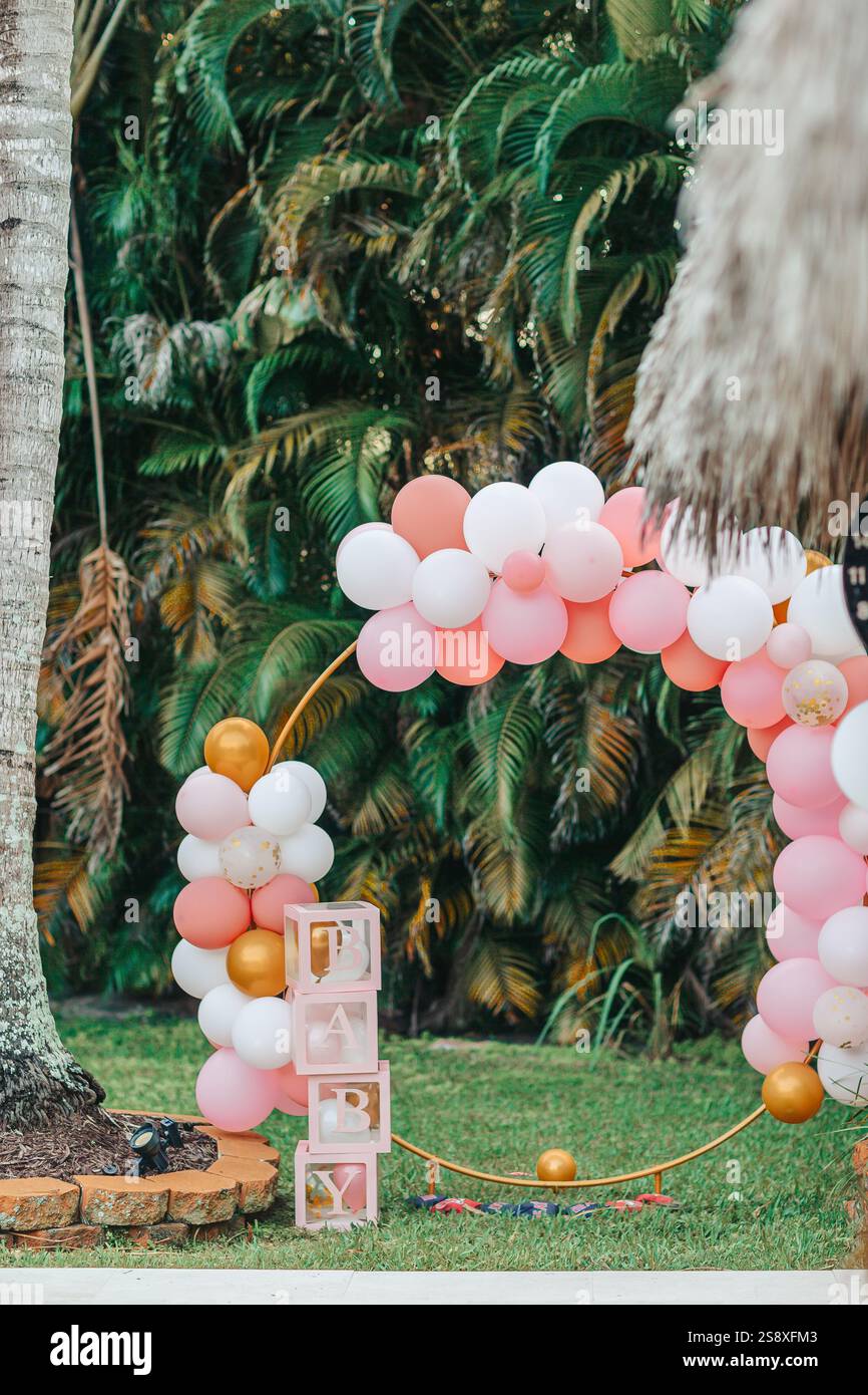 Baby shower party decor, arch of pink balloons and decorations. High ...