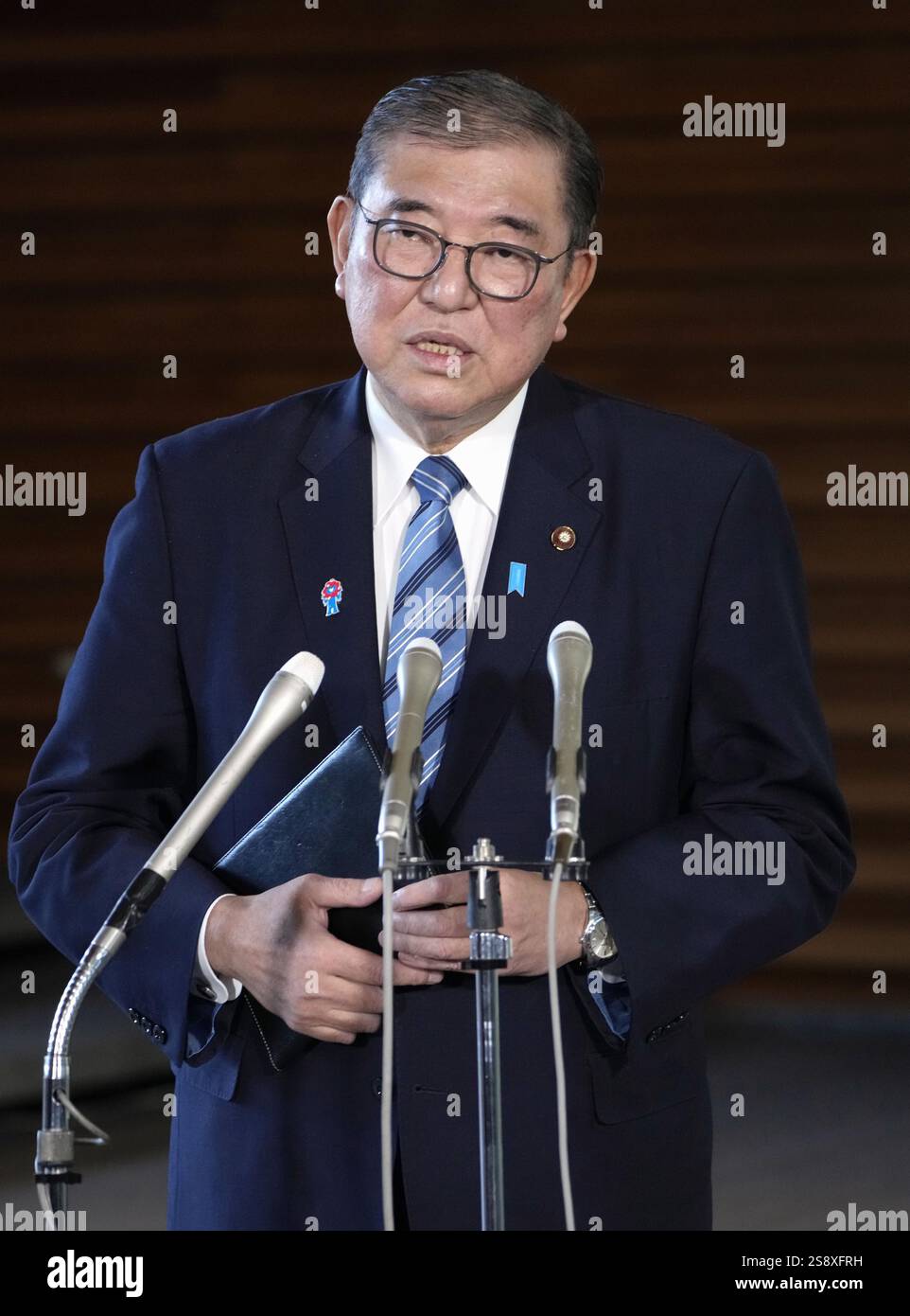Japanese Prime Minister Shigeru Ishiba speaks to reporters at the premier's office in Tokyo on ...