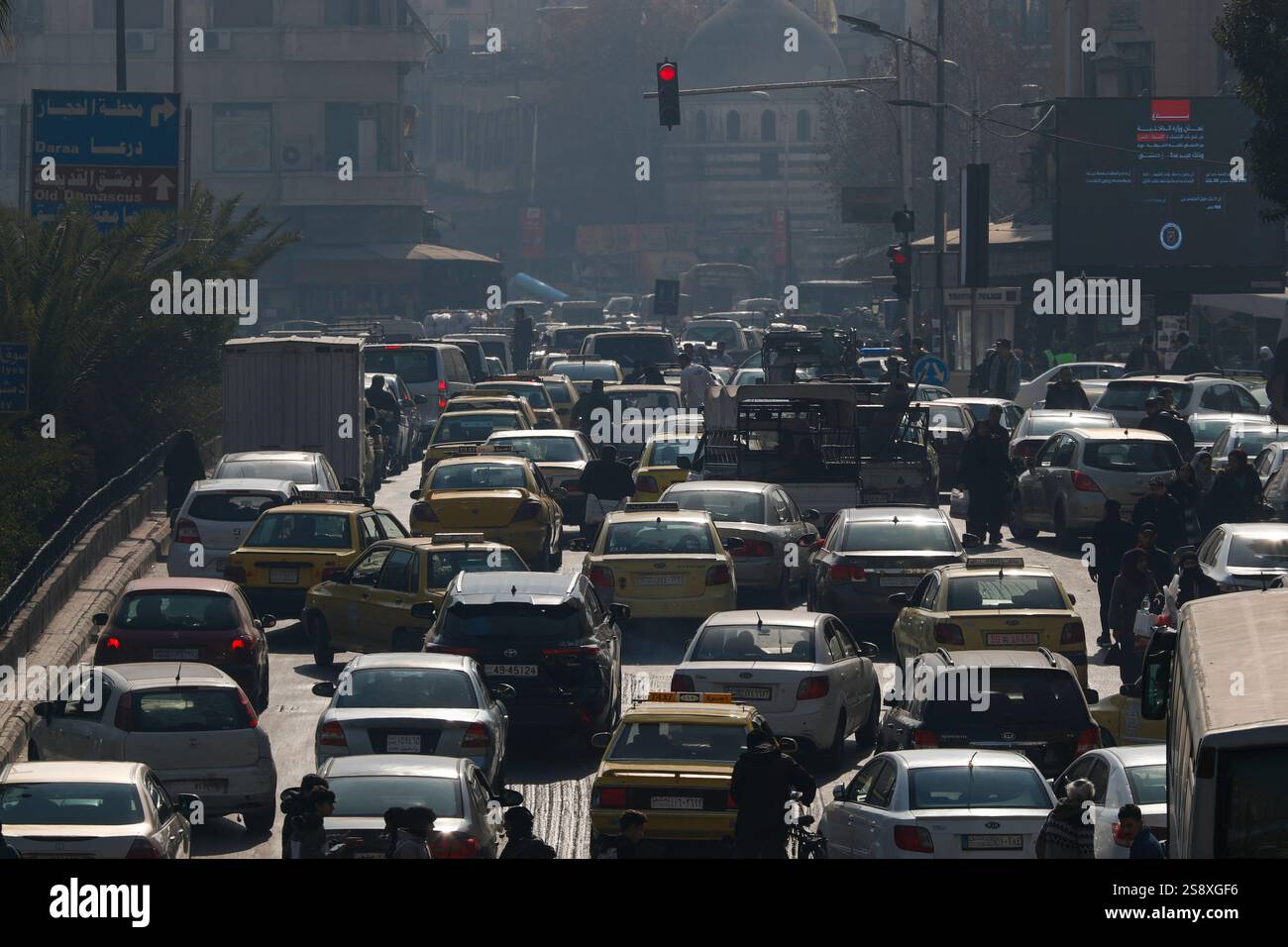 Commuters navigate heavy traffic in Damascus, Syria, Thursday, Jan. 16 ...