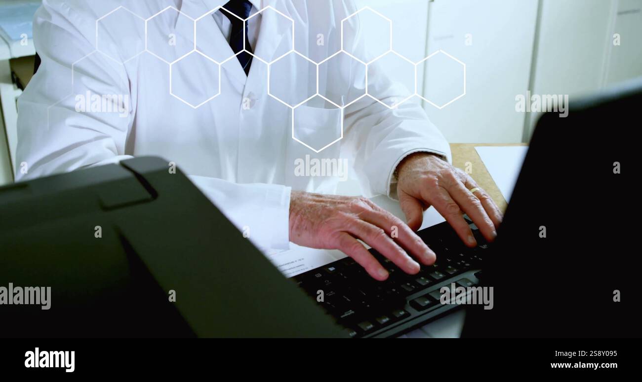 Image of hexagons over caucasian male scientist using computer in lab ...