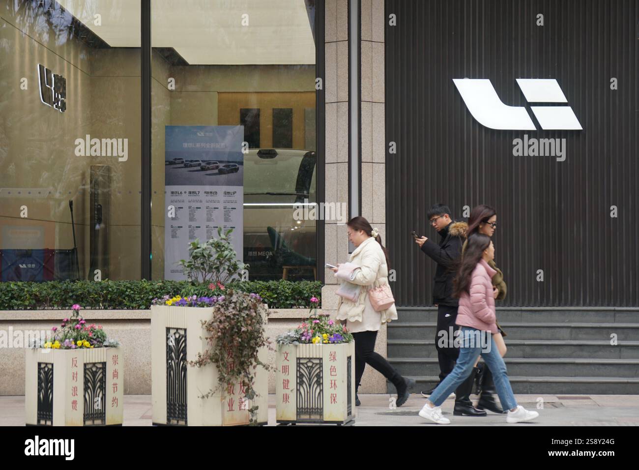 SHANGHAI, CHINA - JANUARY 24, 2025 - Pedestrians pass an Li Auto ...