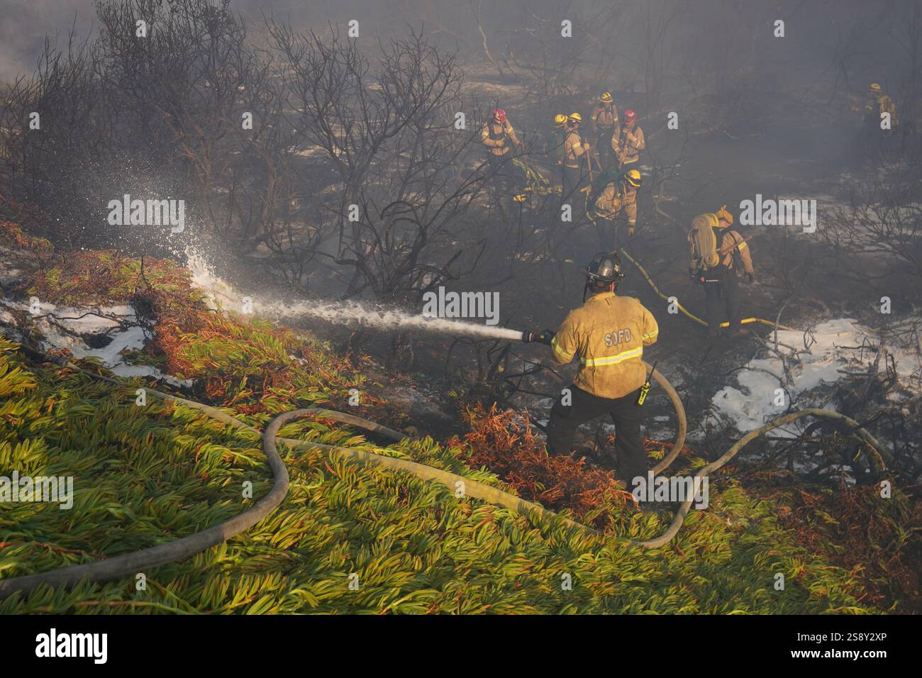 Firefighters battle with the fire at the fire scene. The Gilman Fire ...