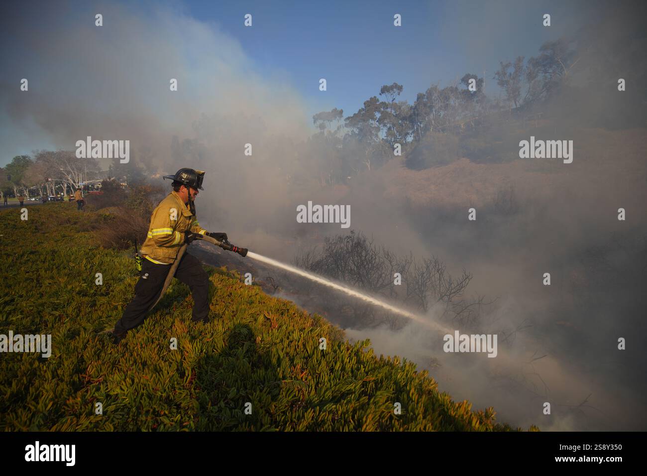 Firefighters battle with the fire at the fire scene. The Gilman Fire ...