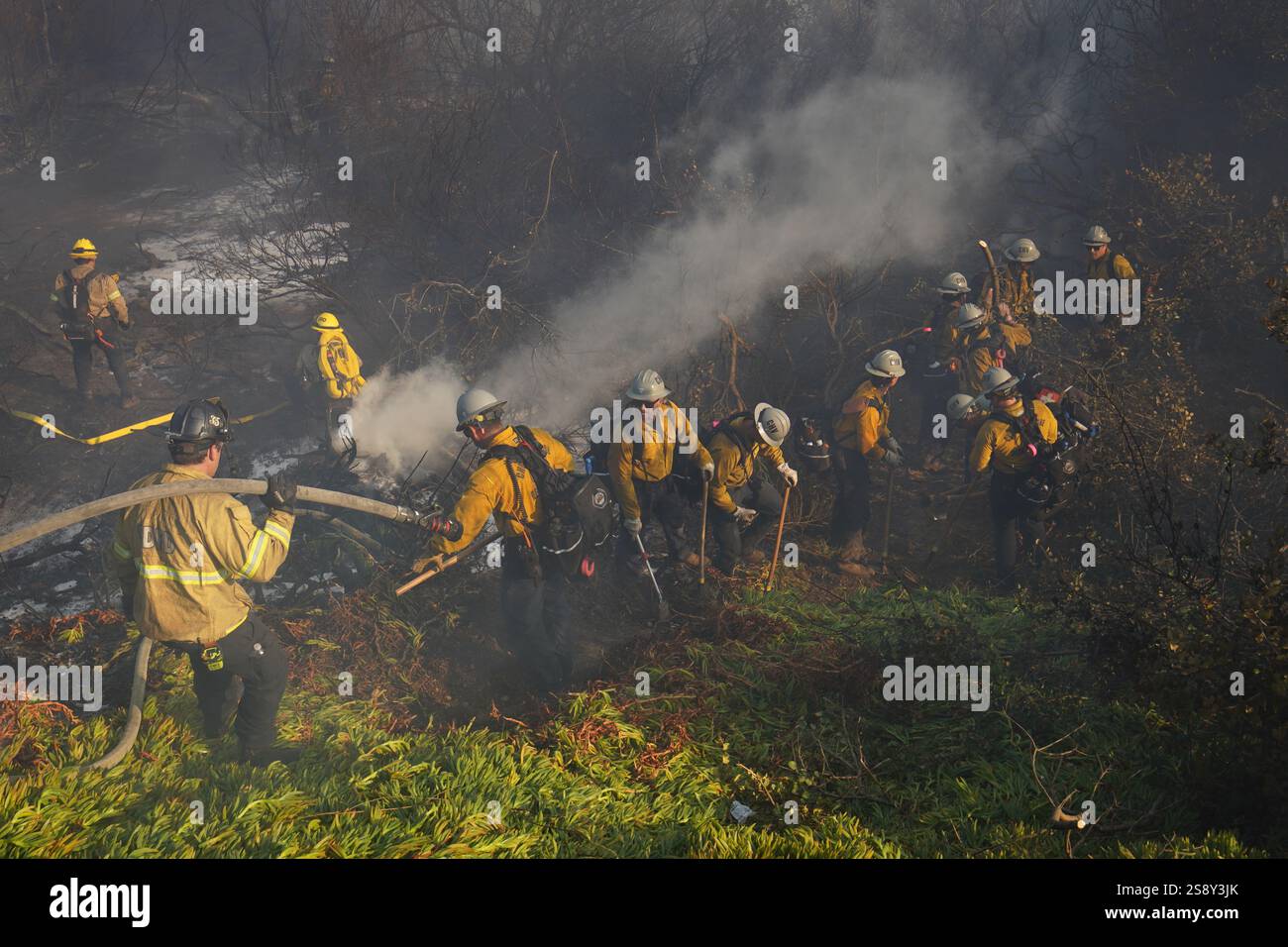 Firefighters battle with the fire at the fire scene. The Gilman Fire ...