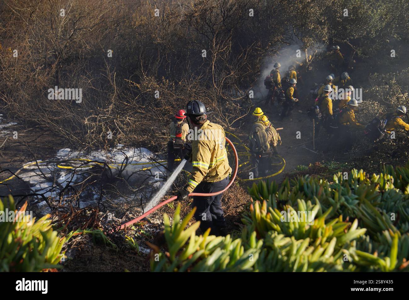 Firefighters battle with the fire at the fire scene. The Gilman Fire ...