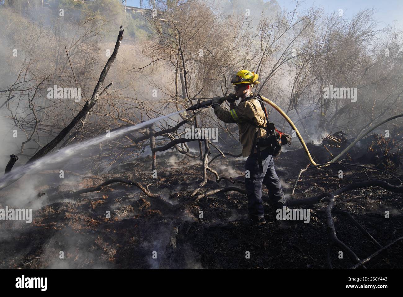 Firefighters battle with the fire at the fire scene. The Gilman Fire ...