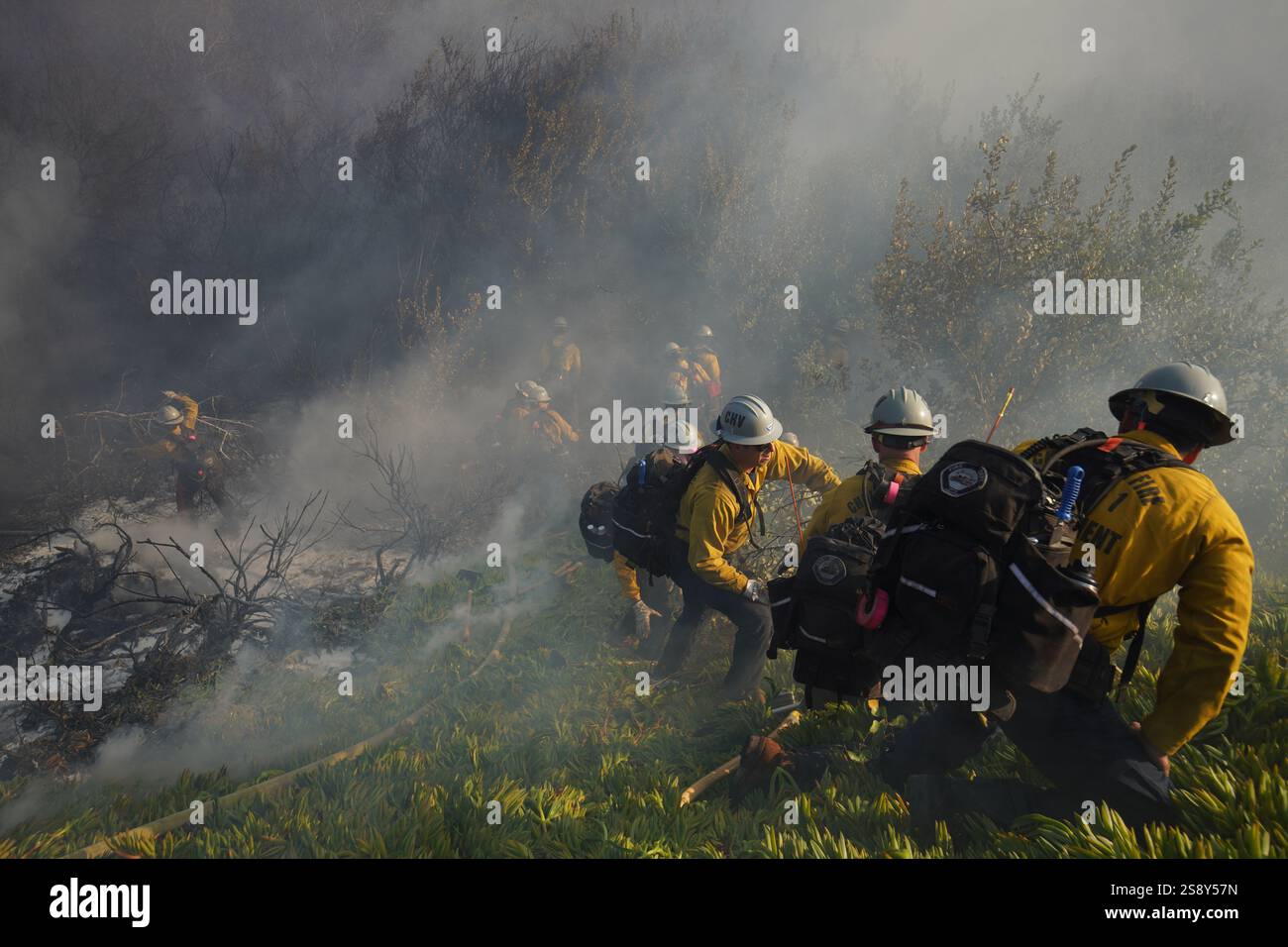 Firefighters battle with the fire at the fire scene. The Gilman Fire ...