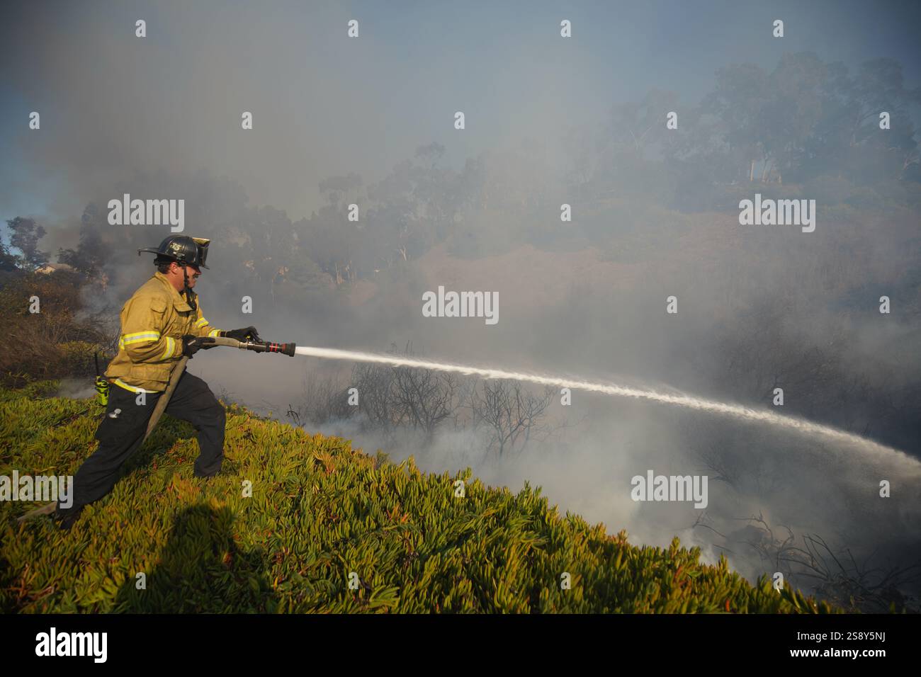 Firefighters battle with the fire at the fire scene. The Gilman Fire ...