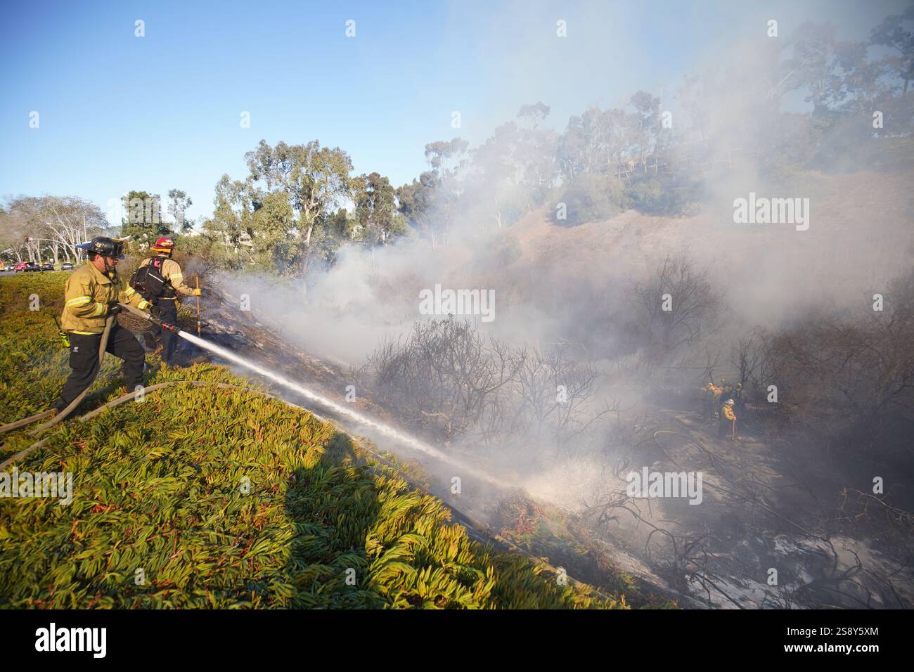 Firefighters battle with the fire at the fire scene. The Gilman Fire ...