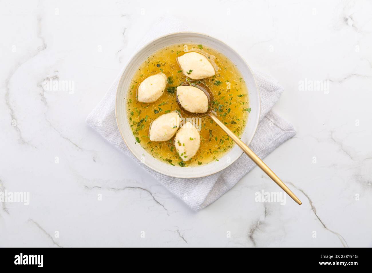 Chicken broth, clear bouillon soup with semolina dumplings Stock Photo ...