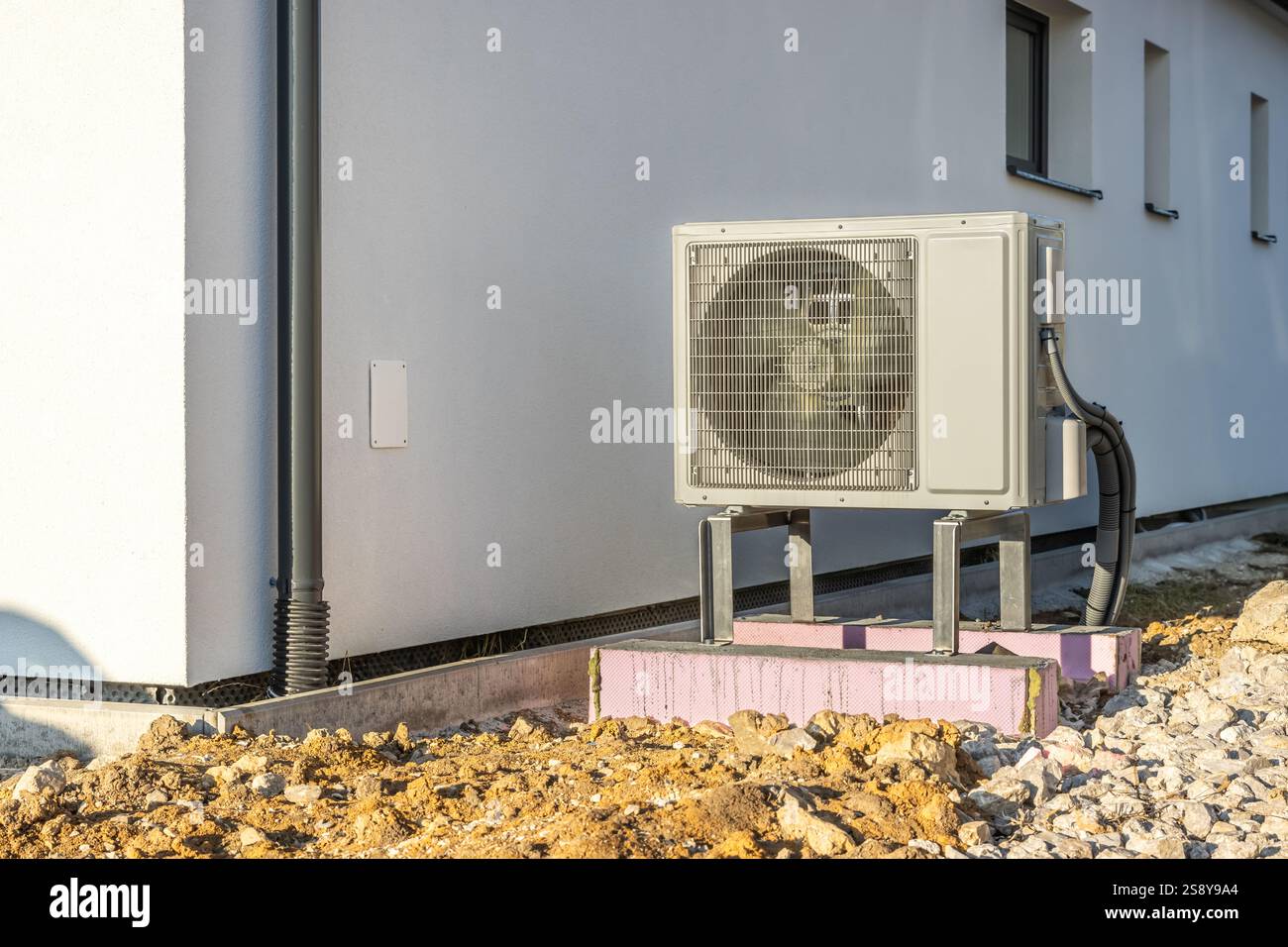 Air source heat pump installed outside of new and modern city house ...