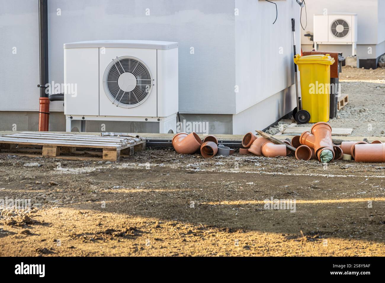 Air source heat pumps installed outside of new and modern city house ...
