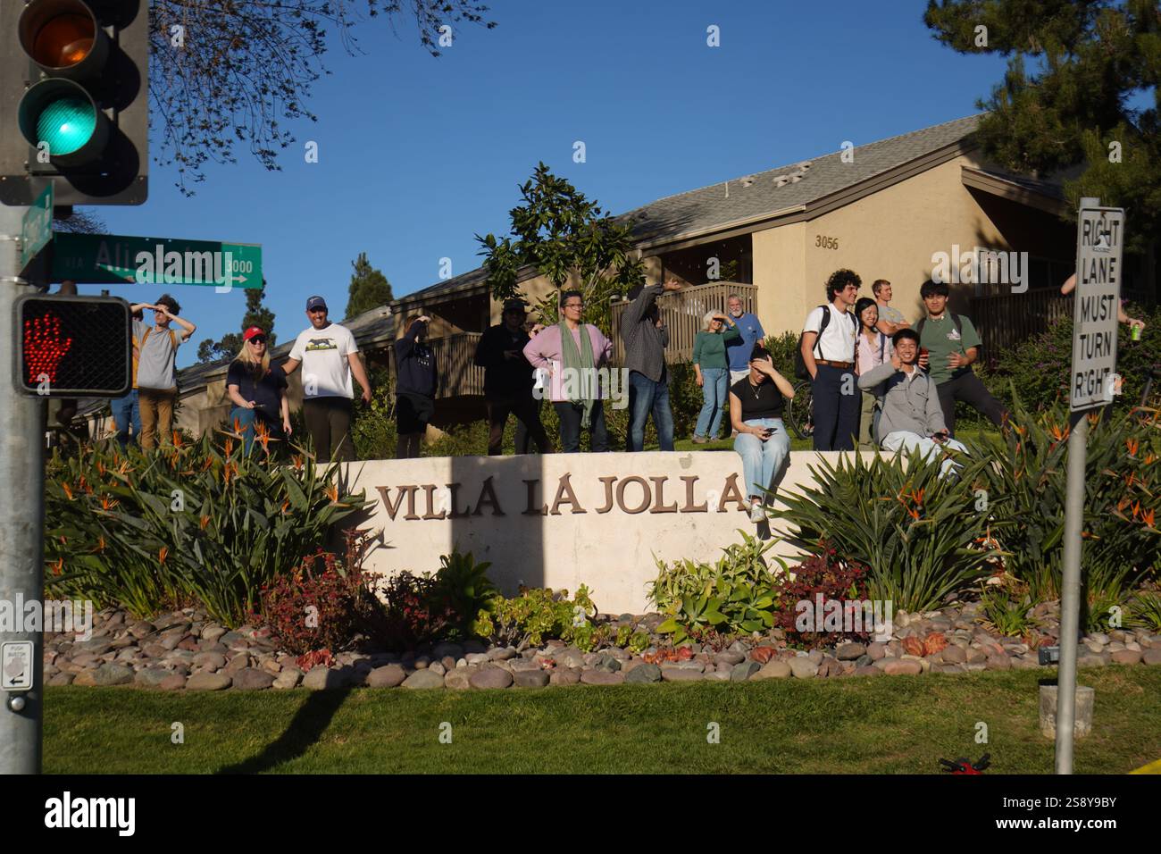 Residents from La Jolla community watch the wildfire in front of their ...