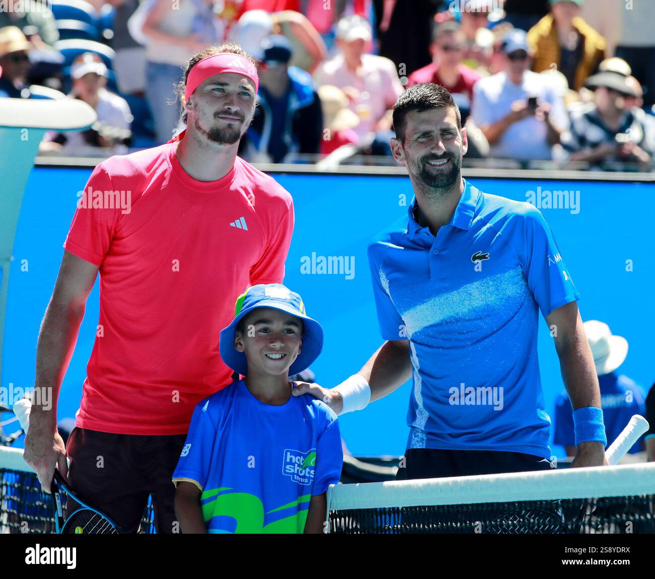 (250124) -- MELBOURNE, Jan. 24, 2025 (Xinhua) -- Novak Djokovic(R) of Serbia and Alexander ...