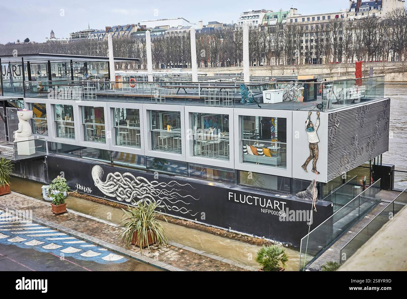 Fluctuart boat, floating urban art centre, moored on a bank of the ...