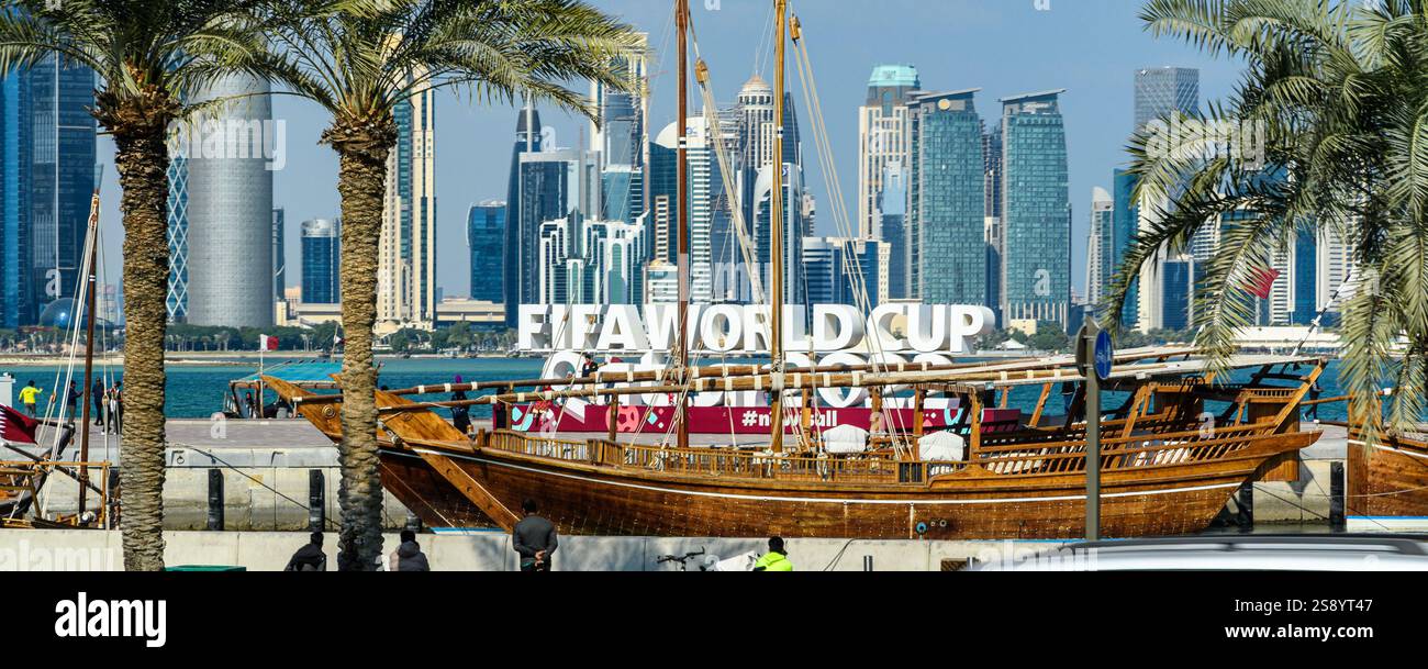 Doha, Qatar - January 4, 2025: A traditional wooden dhow boat with FIFA ...