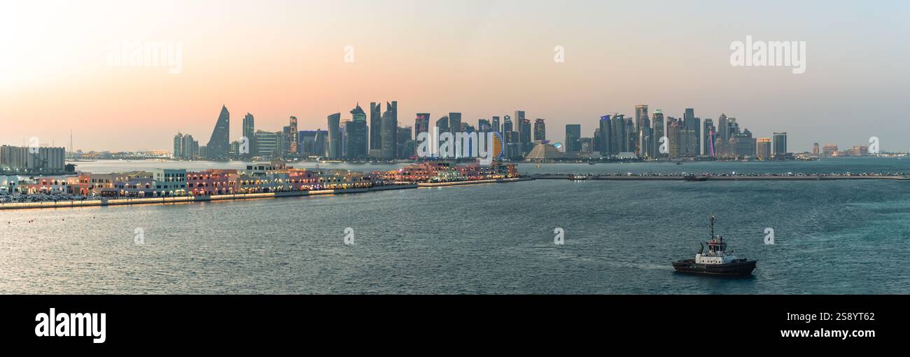 Doha, Qatar - January 4, 2025: The vibrant skyline of Doha glows under ...
