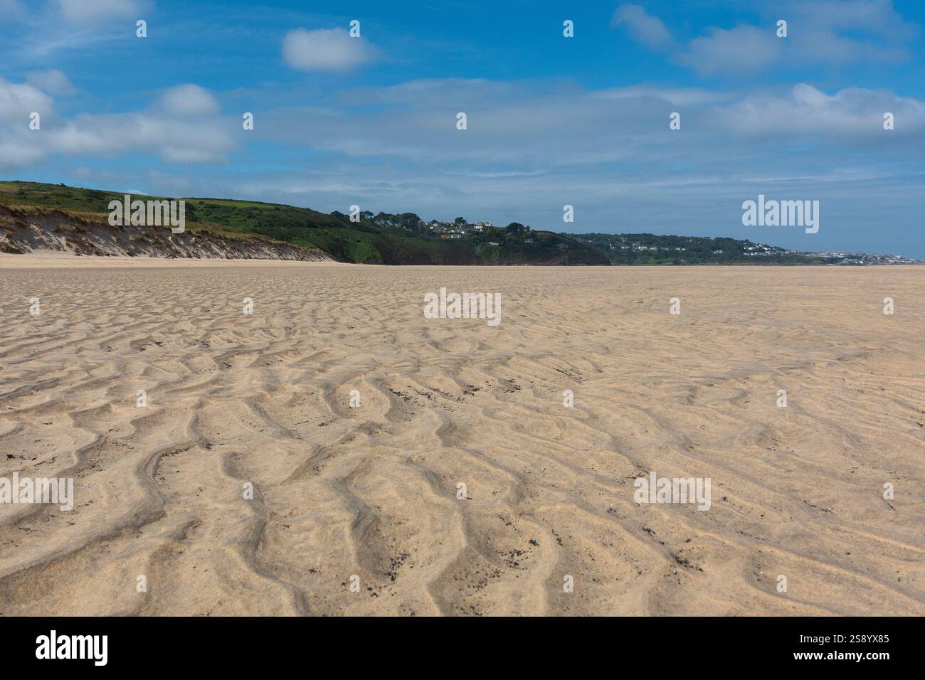 View across the sand patterns of Porthkidney Beach towards Hawkes Point ...