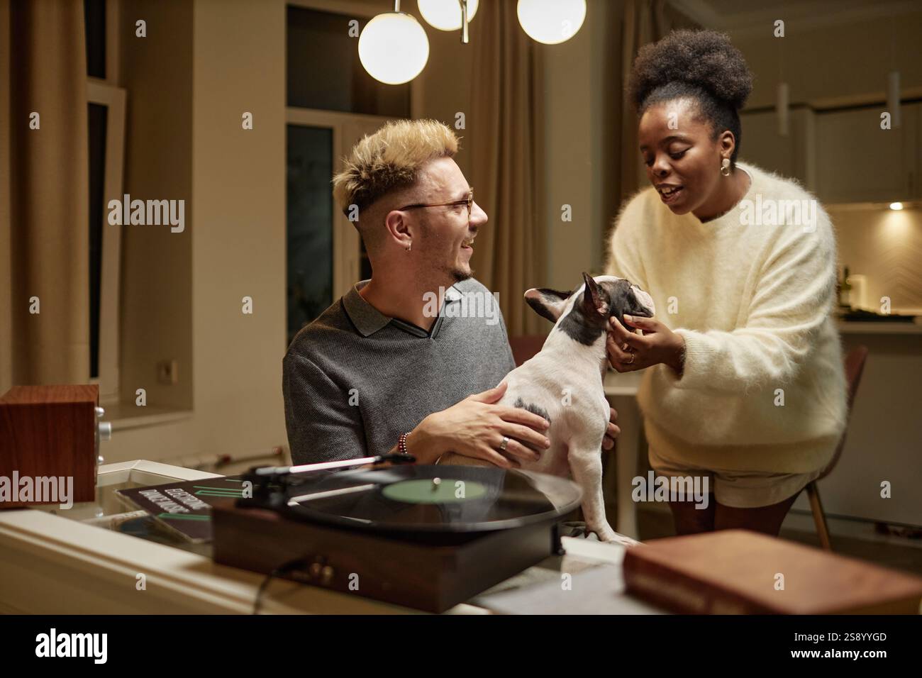 Cheerful multiethnic couple petting hi-res stock photography and images ...